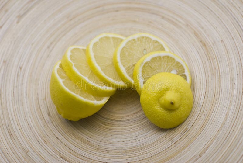 Slices of lemon on plate stock photo. Image of ingredient - 11127320