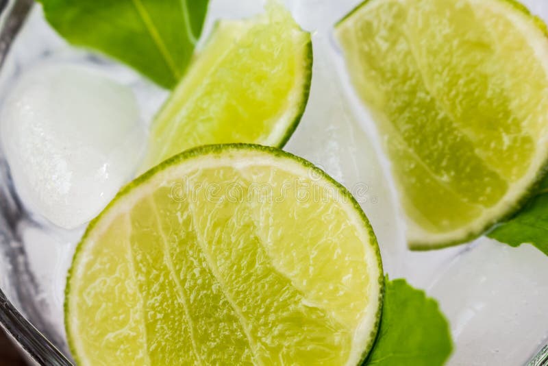 Slices of lime with ice stock image. Image of juice - 102625835