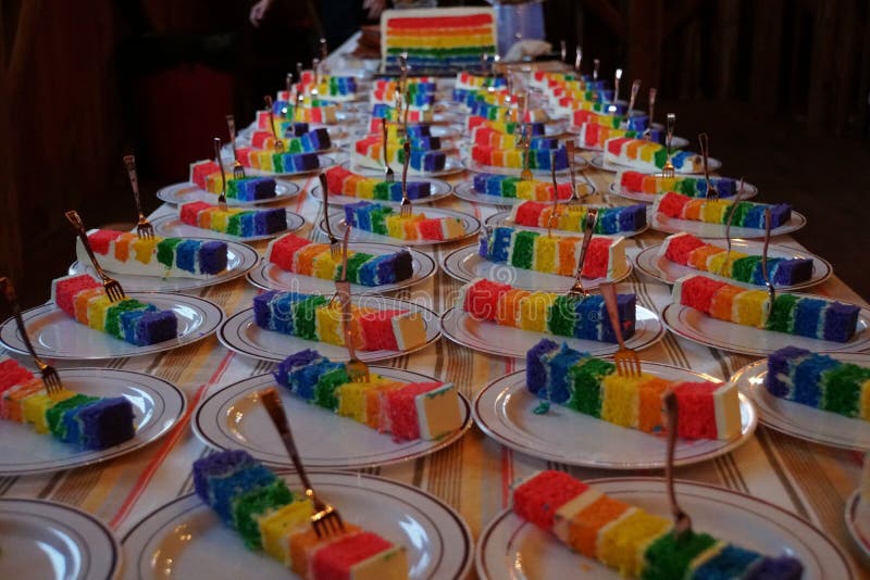 Slices of Rainbow Cakes with Silver Forks on the Table Stock Image ...