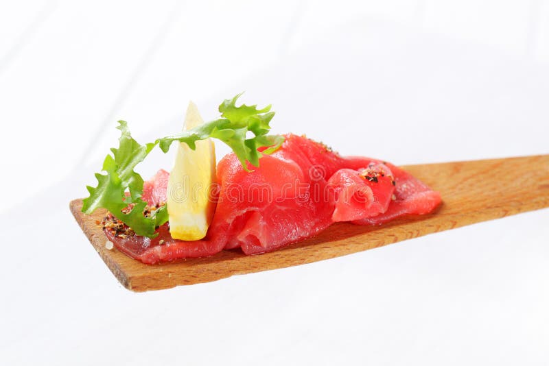 Slices of Raw Beef on Spatula Stock Photo - Image of carpaccio, sirloin ...