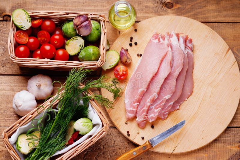 Slices of Raw Pork Meat and Vegetables Stock Photo - Image of knife ...