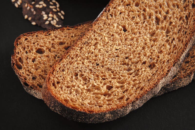 Slices of Rye Bread on Black Background Stock Photo - Image of crust ...