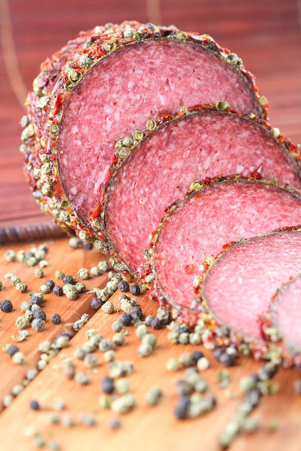 Slices of Salami with Pepper Grains Stock Photo - Image of white, shot ...