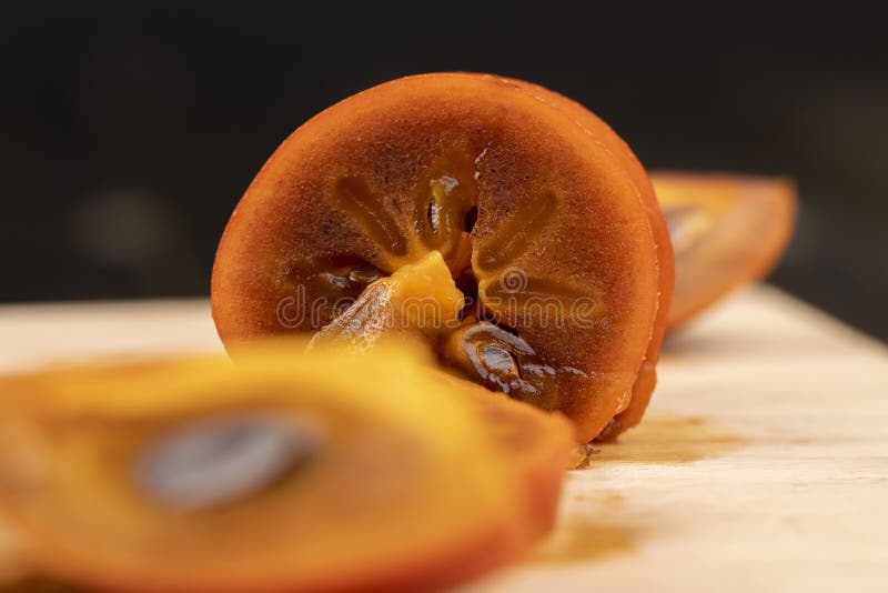 Slices of Sliced Persimmon on a Cutting Board Stock Image - Image of ...