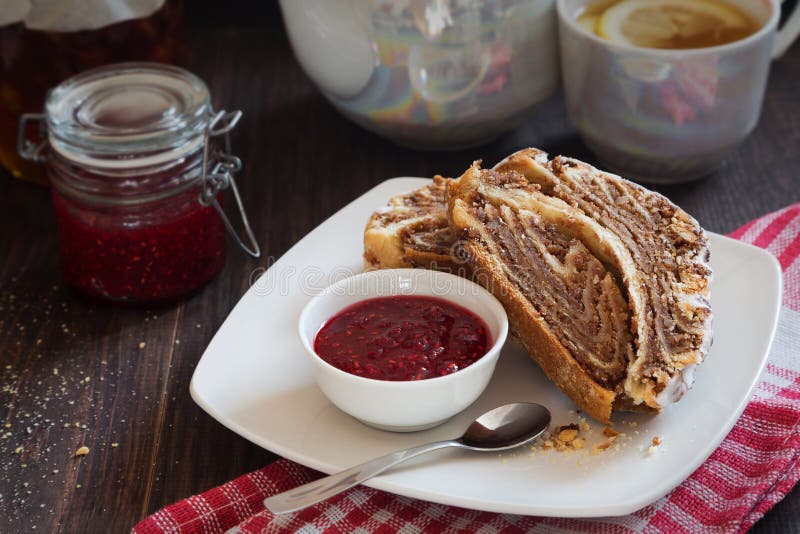 Slices of a Swiss Roll and Jam on a White Plate Stock Image - Image of ...