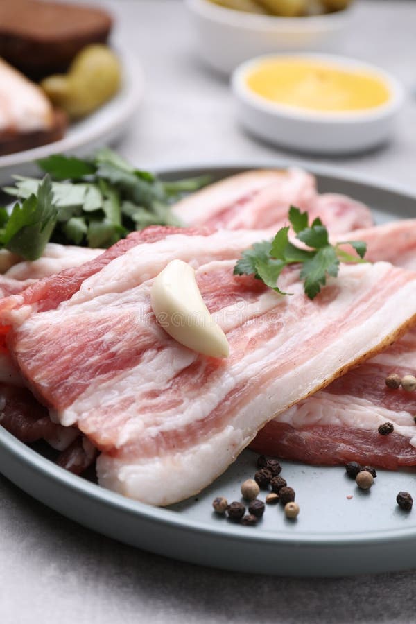 Slices of Tasty Pork Fatback with Spices on Grey Table, Closeup Stock ...