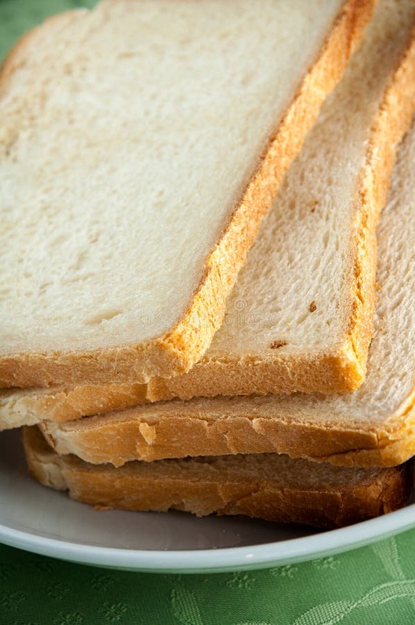 Slices of Toast Bread on a White Plate Stock Photo - Image of loaf ...