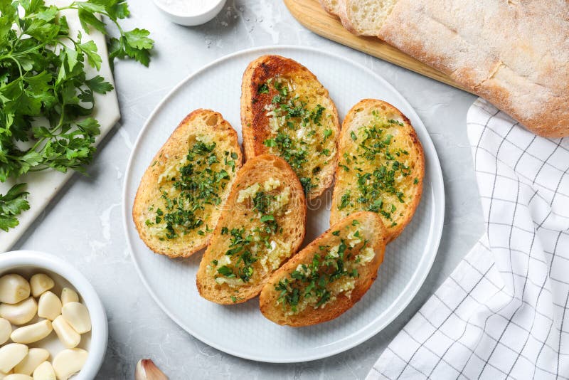 Slices of Toasted Bread with and Herb on Light Grey Marble Table, Flat ...