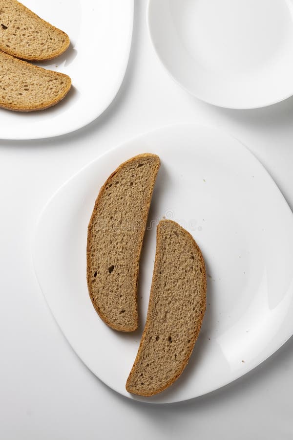 Slices of Wholemeal Bread in Empty Plates, Dieting, Poverty Concept ...