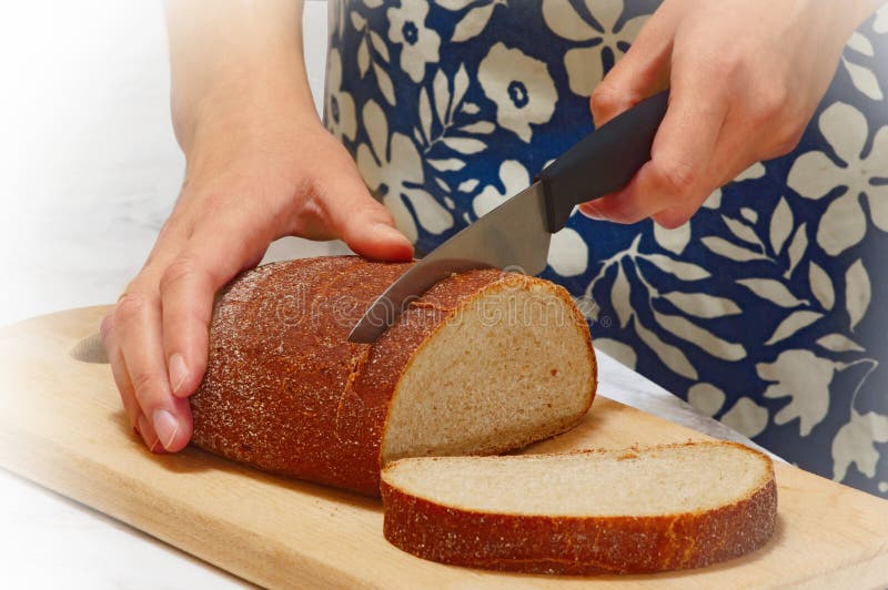 Slicing bread stock image. Image of product, sliced, hands - 78121657