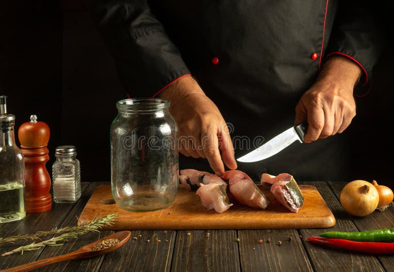 Slicing Carp Fish with a Knife in the Chef Hand. the Process of ...