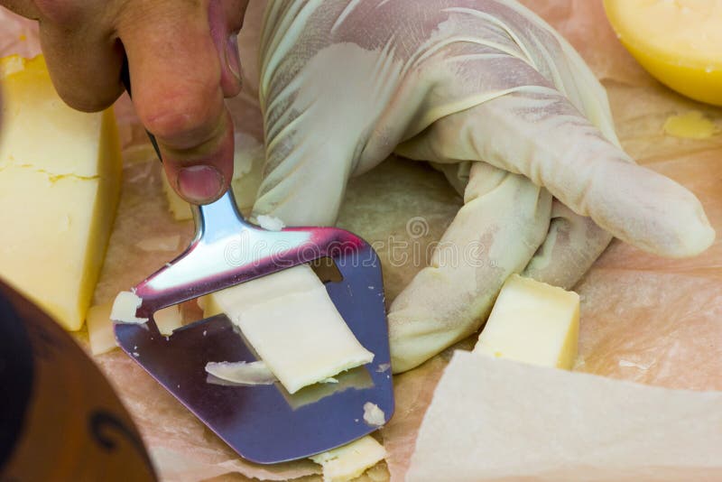 Slicing cheese for tasting stock photo. Image of ingredient - 95498350