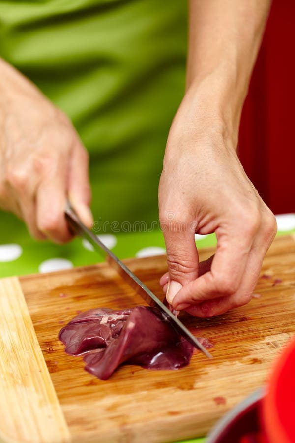 Slicing chicken liver stock photo. Image of chop, hands - 37504006