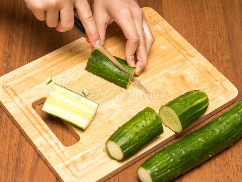 Slicing Cucumber with a Knife on the Board Stock Image - Image of ...
