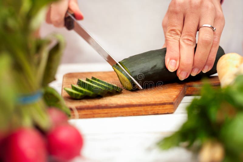 Slicing of Cucumber with a Knife Stock Image - Image of cuisine, diet ...