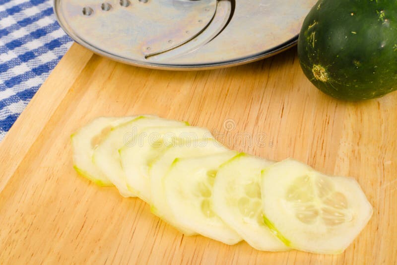 Slicing cucumber stock photo. Image of slicing, disk - 49038052