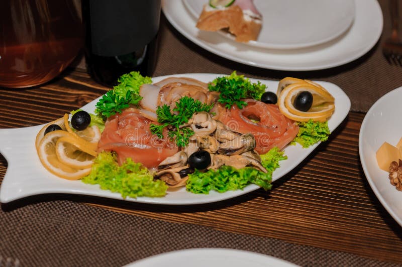 Slicing Different Types of Red and White Fish on a Buffet Table ...