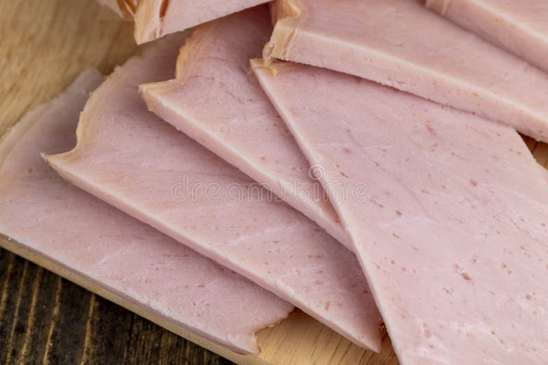 Slicing a Finished Piece of Ham into Small Pieces Stock Photo - Image ...