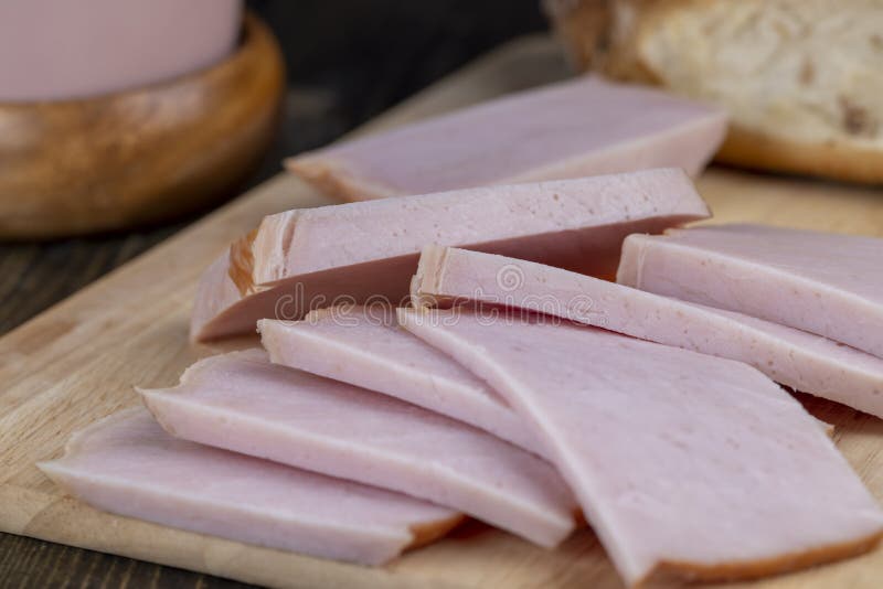 Slicing a Finished Piece of Ham into Small Pieces Stock Photo - Image ...