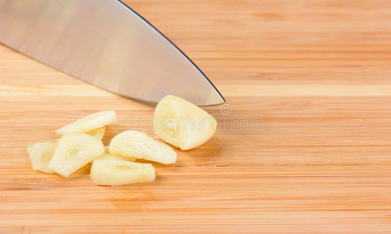 Slicing Garlic Closeup stock photo. Image of wood, agriculture - 57602354