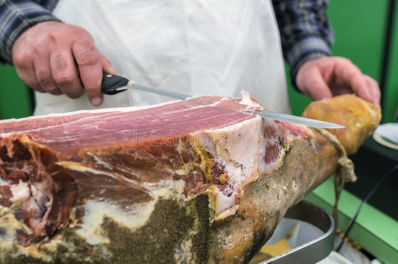 Slicing of Italian Dry-cured Ham Prosciutto Stock Image - Image of ...