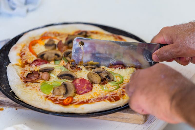 Slicing pizza. stock image. Image of vibrant, composition - 9862909