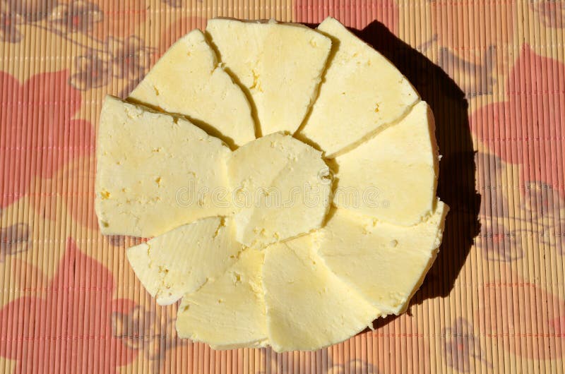 Slicing Sour Milk Cheese Cheese in the Shape of a Flower. Stock Image ...