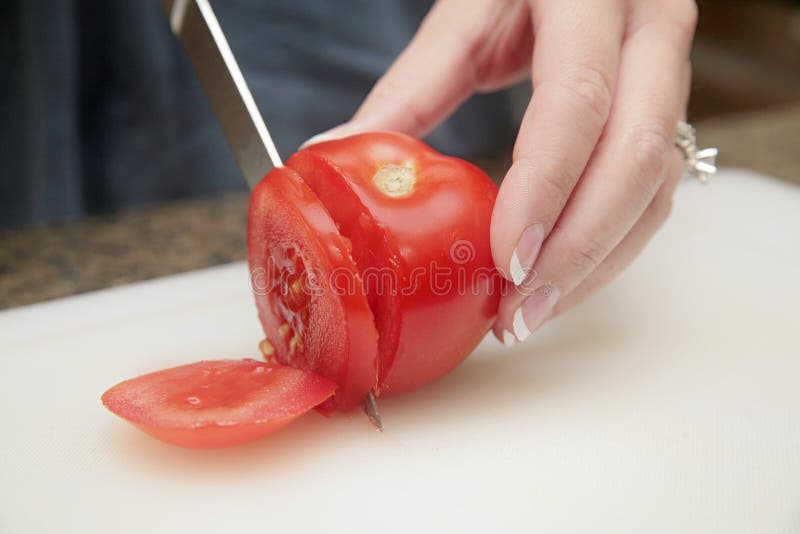 Cutting tomato stock image. Image of knife, grate, eating - 10402117