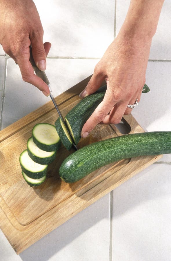 Slicing the zucchini stock image. Image of summer, classical - 23705995