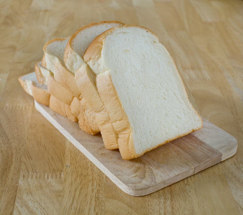 Slide Bread on Wooden Cutting Board Stock Image - Image of loaf ...