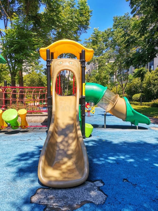 The slide stock image. Image of kids, garden, childhood - 253258065