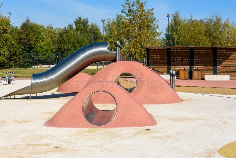 Slide and Tubes on a Playground in a Park on a Summer Day. Stock Photo ...