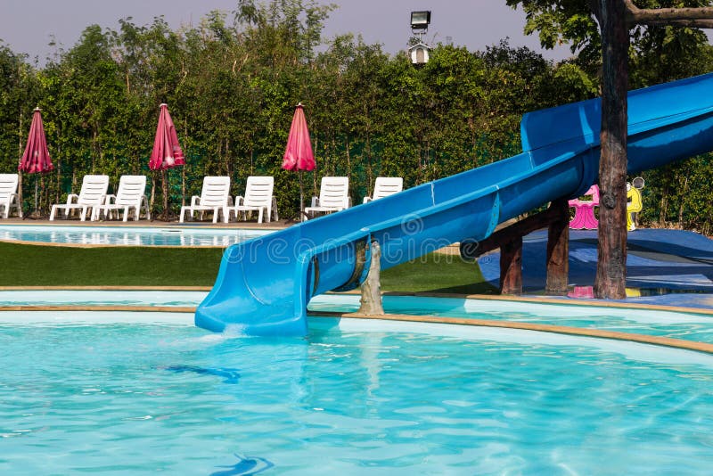 Slider beside Swimming Pool Stock Image - Image of colorful, leisure ...