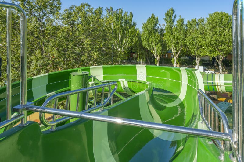 Slides that Descend from a High Platform into a Pool or Water Channel ...