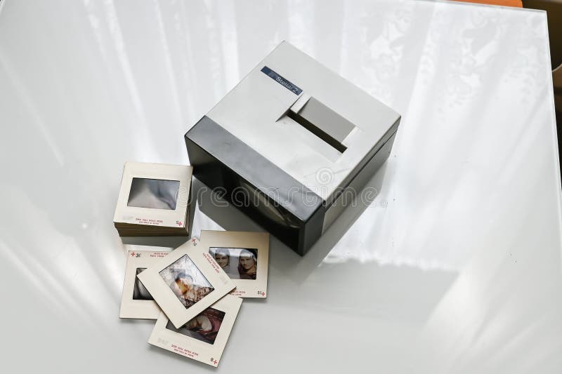 Slides Scattered on a Table and Slide Viewer Editorial Stock Image ...