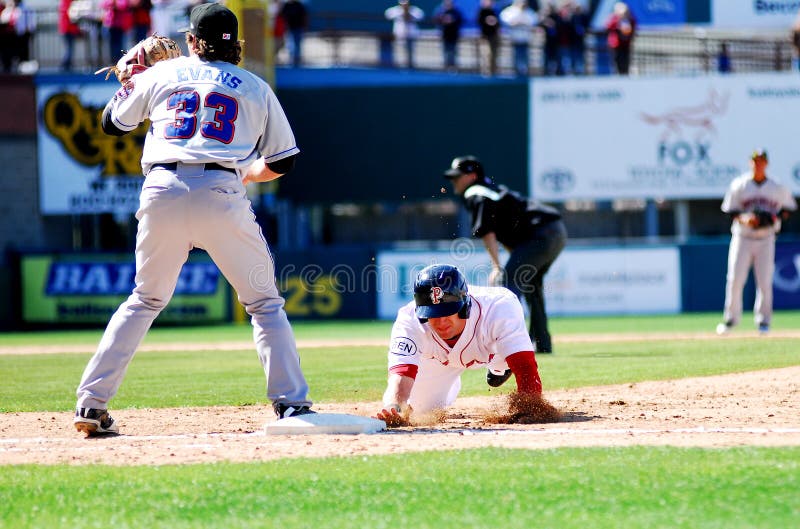 Sliding back to first base editorial photo. Image of pawtucket - 19202481