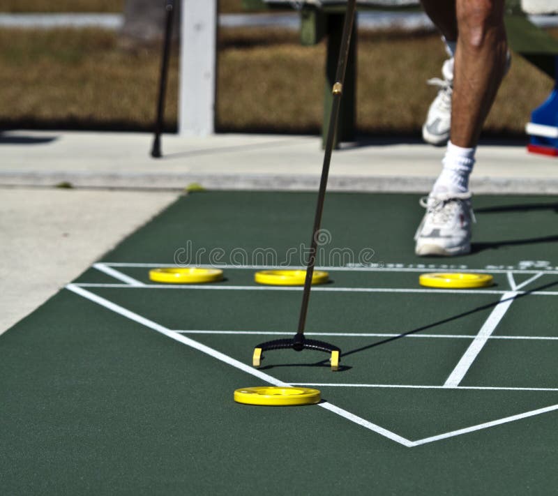 Sliding the Disc stock photo. Image of block, shuffleboard - 12753764