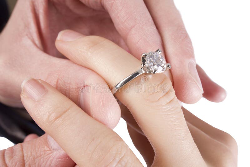 Sliding the Engagement Ring on Stock Photo - Image of married, silver ...