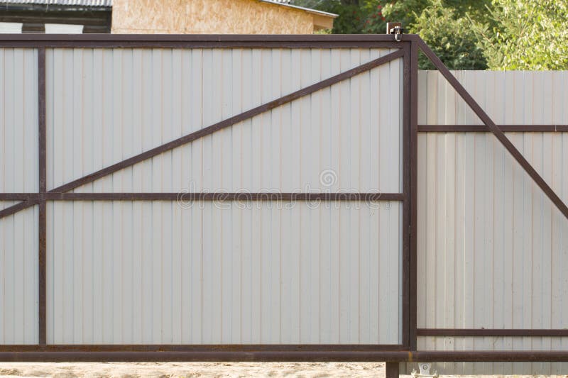 Sliding Iron Gates Near the House.a Gate for a Car Stock Image - Image ...