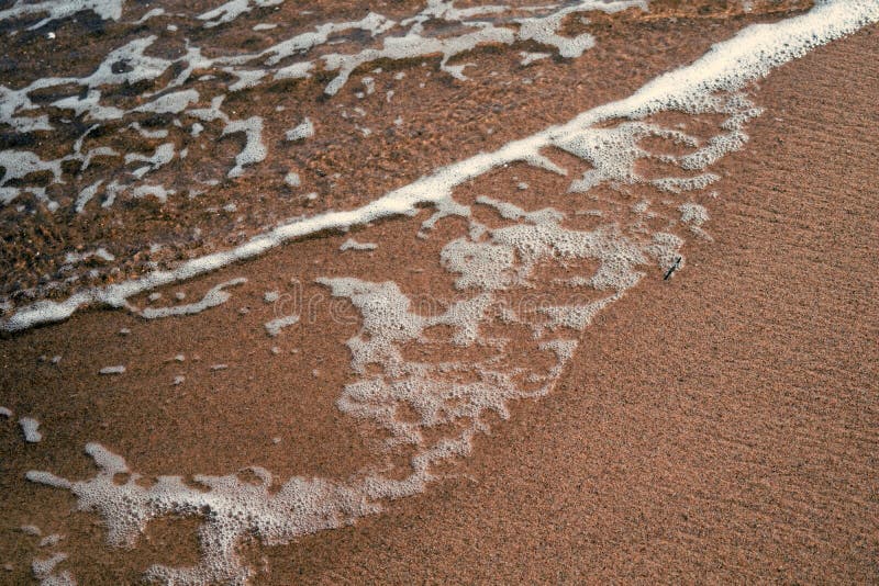 Slightly Foamed Sea Water, Pouring Out Beach Sand Stock Photo - Image ...
