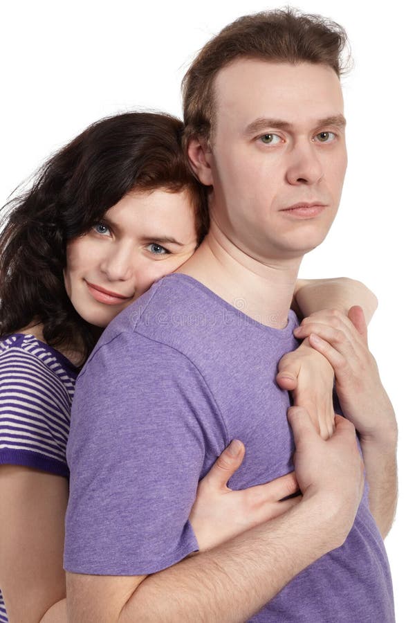 Slightly Smiling Woman Embraces Man from Behind Stock Photo - Image of ...