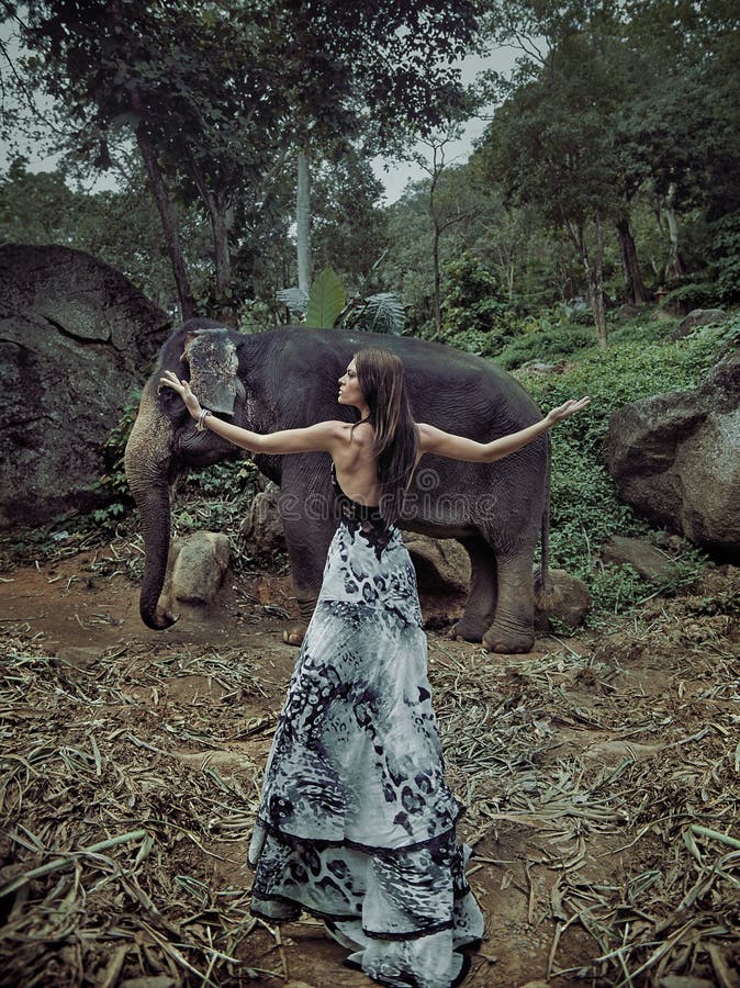 Slim, Brunette Lady with Small Elephant Stock Image - Image of gown ...