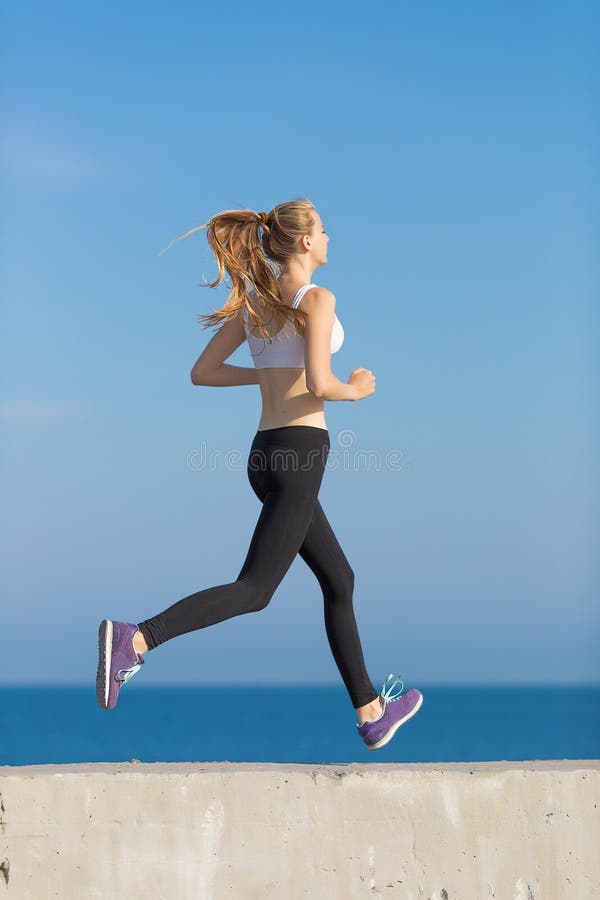 A Tall Girl Stands on a Ladder and Picks Fresh Cherries from a Tree ...