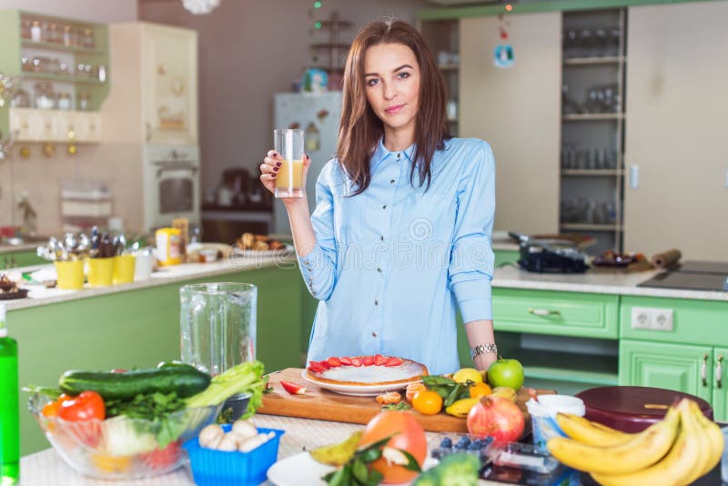 Slim Young Woman Standing in Kitchen Drinking Fresh Juice Stock Image ...