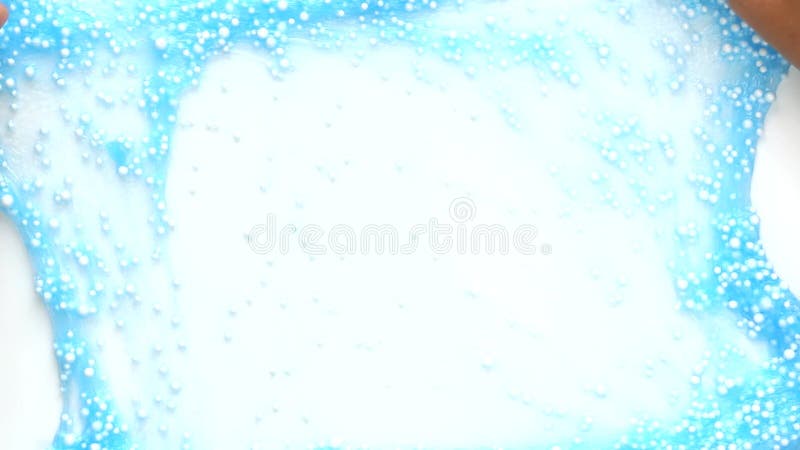 The Slime is Blue with White Foam Balls. ASMR Relaxation Video, Stock ...