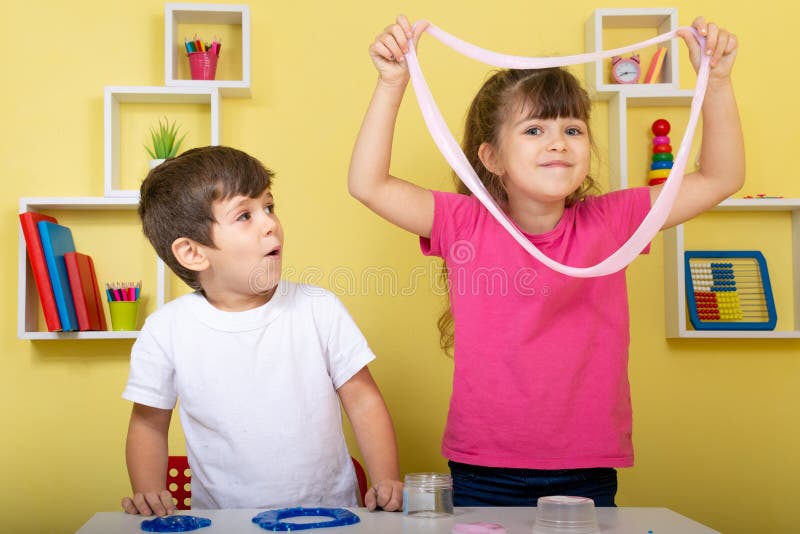 Kids play with slime. stock image. Image of dzungarian - 201988009