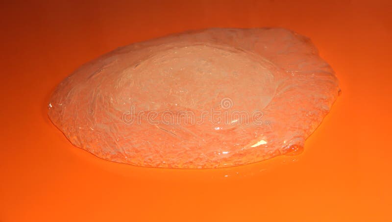 Slime on an Orange Background. Snot White on a Bright Background Stock ...