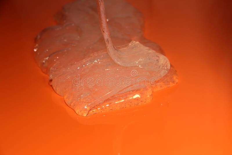 Slime on an Orange Background. Snot White on a Bright Background Stock ...