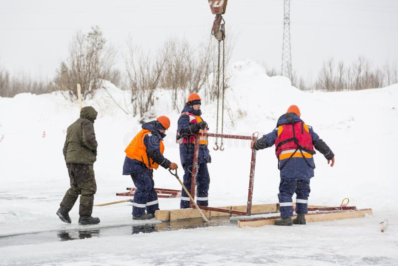 Workers Cut Ice Blocks To the Size of Ice on a Frozen Lake Stock Image ...