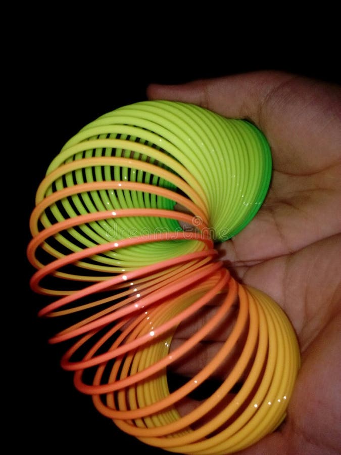 Slinky toy rainbow color editorial photo. Image of color - 108000851